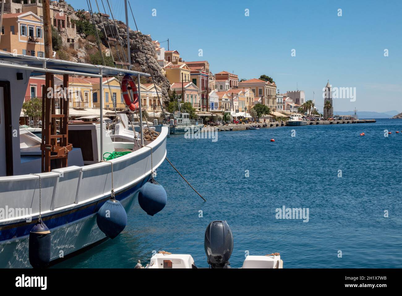 SYMI, Greece - JUN 03, 2021. The harbour of Symi town with the ...