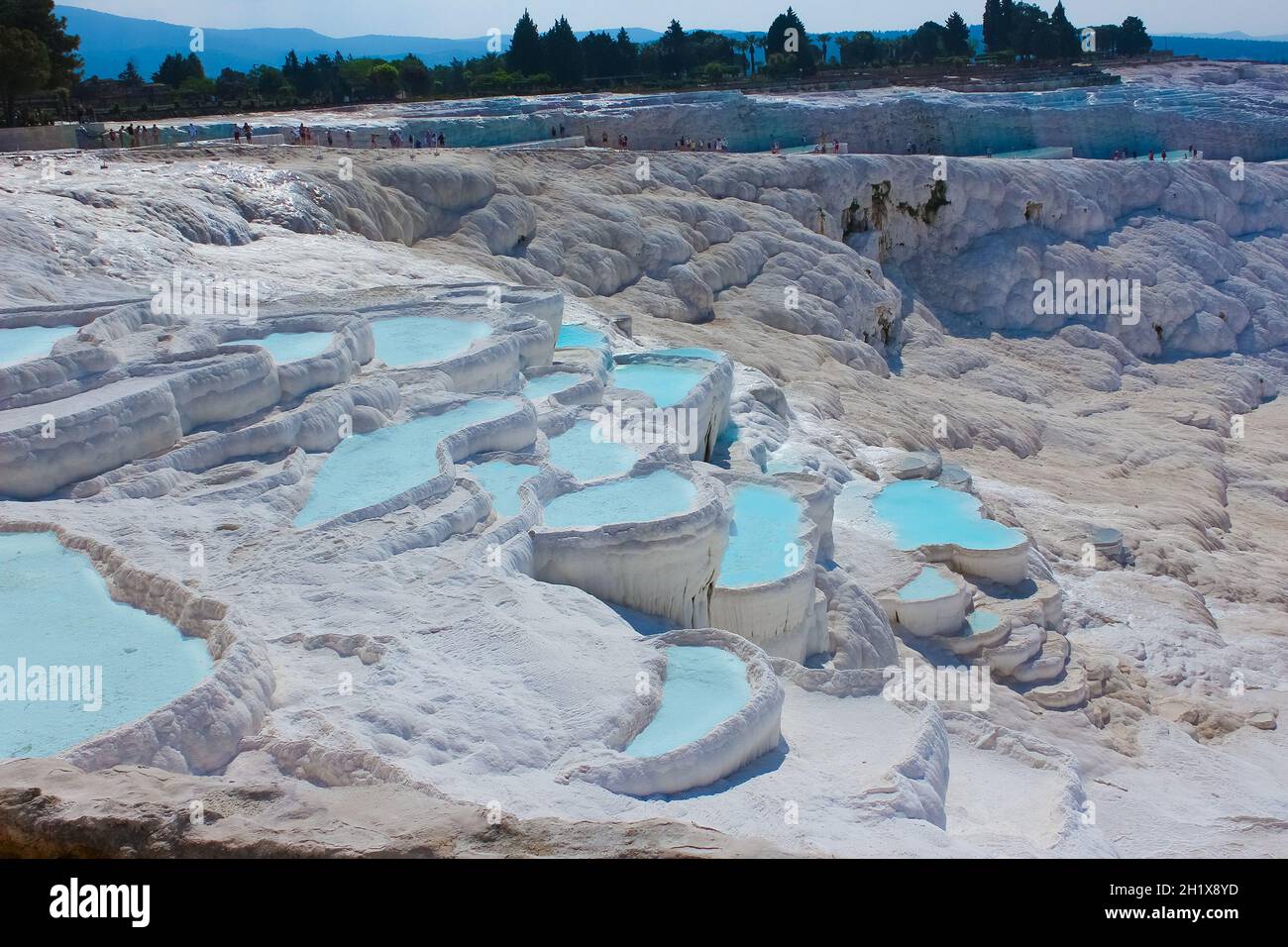 Travertines in Turkey. Calcite cliff of Pamukkale at sunny day Stock ...