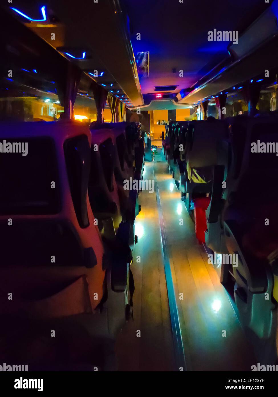 Group of tourist sitting in the bus at night Stock Photo - Alamy