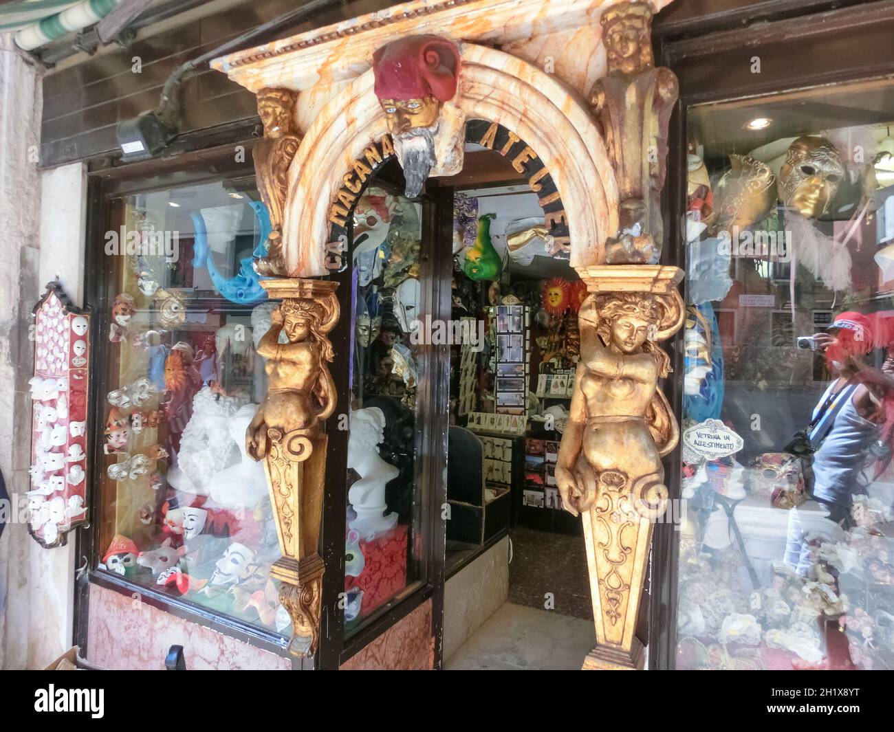 Venice, Italy - May 04, 2017: The shop with traditional souvenirs and gifts at Venice like ...