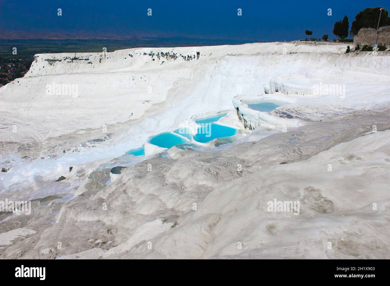 Travertines in Turkey. Calcite cliff of Pamukkale at sunny day Stock ...