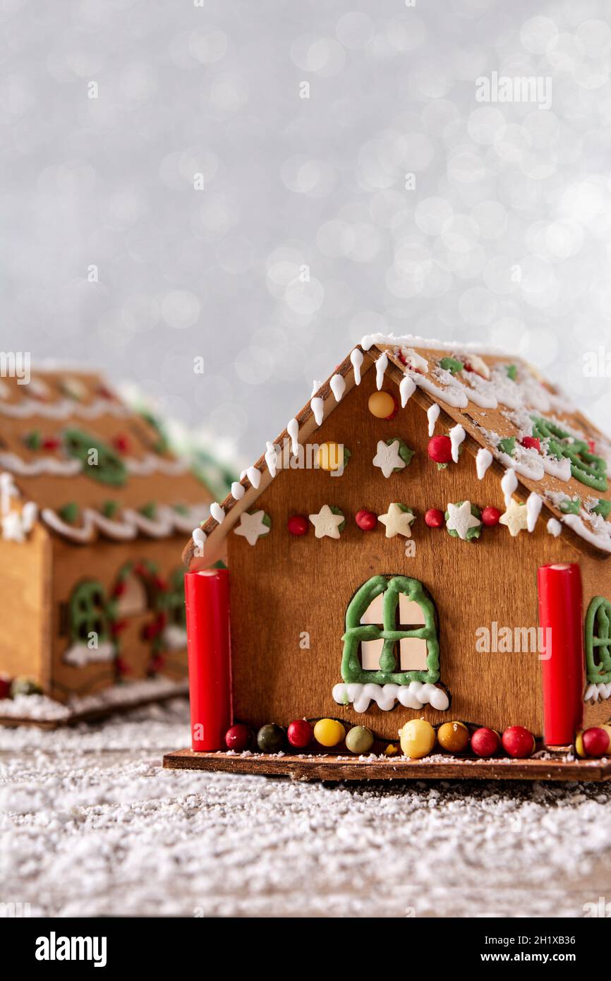 Christmas gingerbread house on white glitter background Stock Photo - Alamy