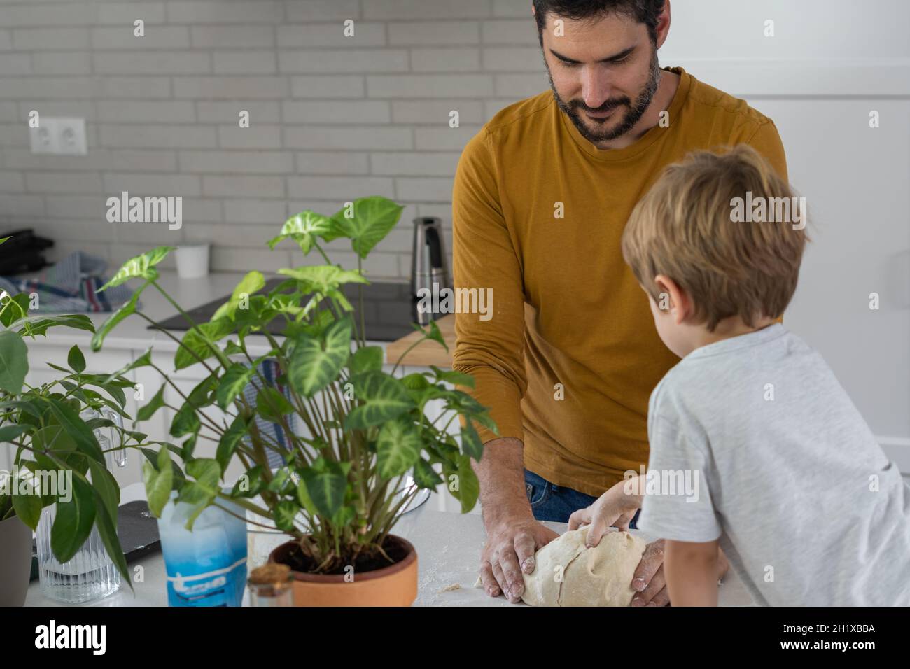 Father and son making bread hi-res stock photography and images - Alamy