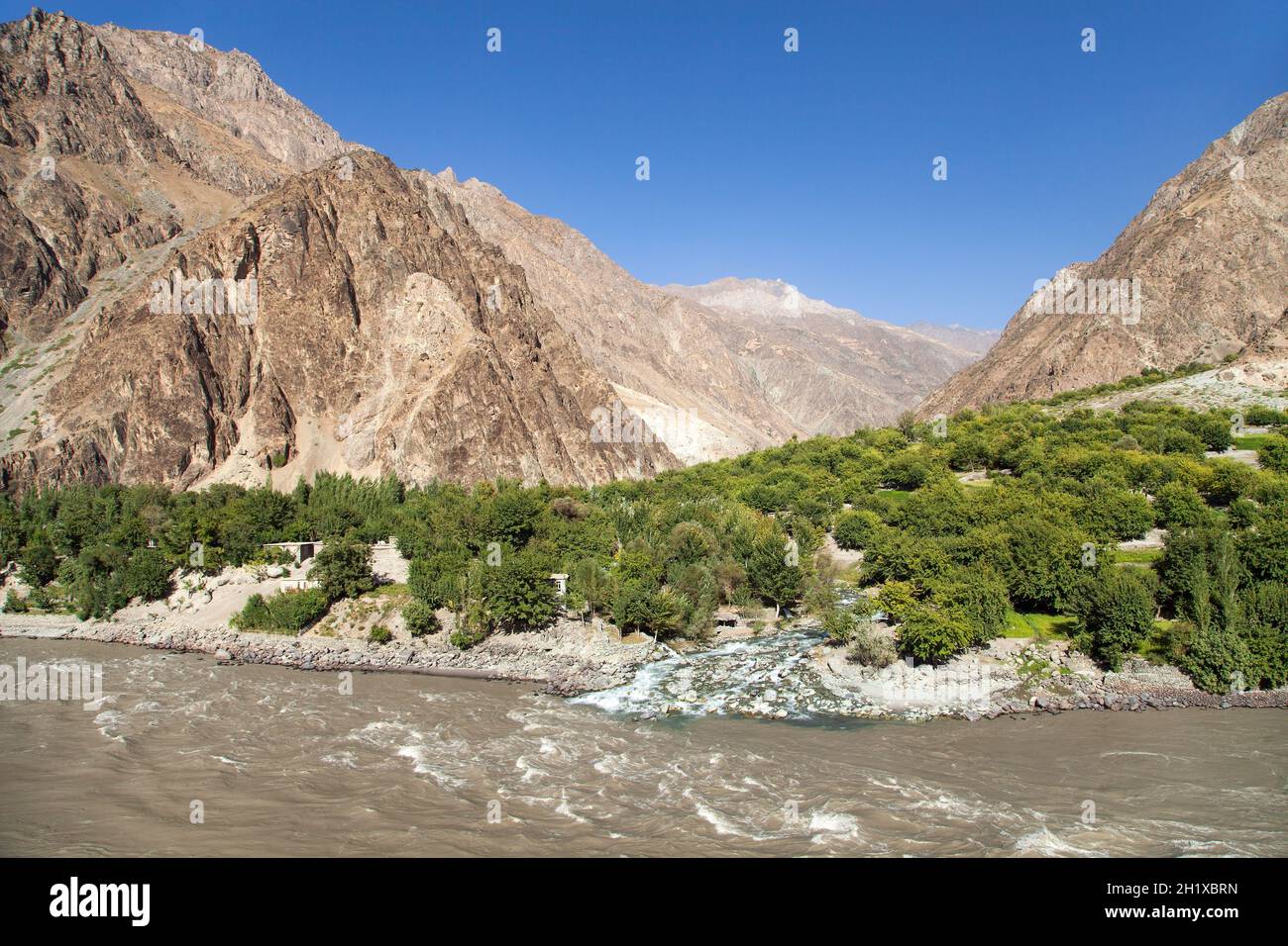 Panj river and Pamir mountains. Panj is upper part of Amu Darya river ...