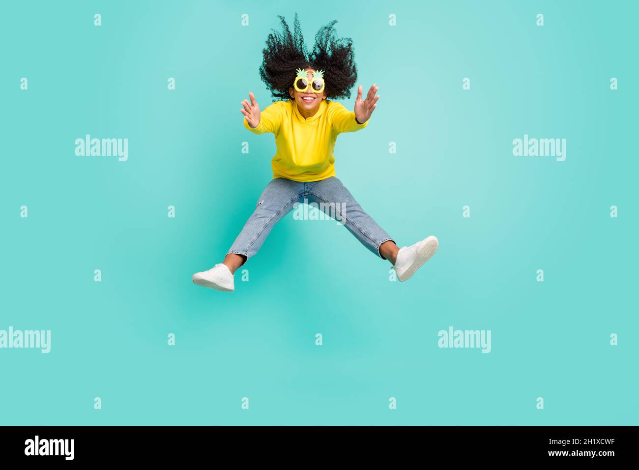 Full length body size photo woman jumping flying on wind in sunglass ...
