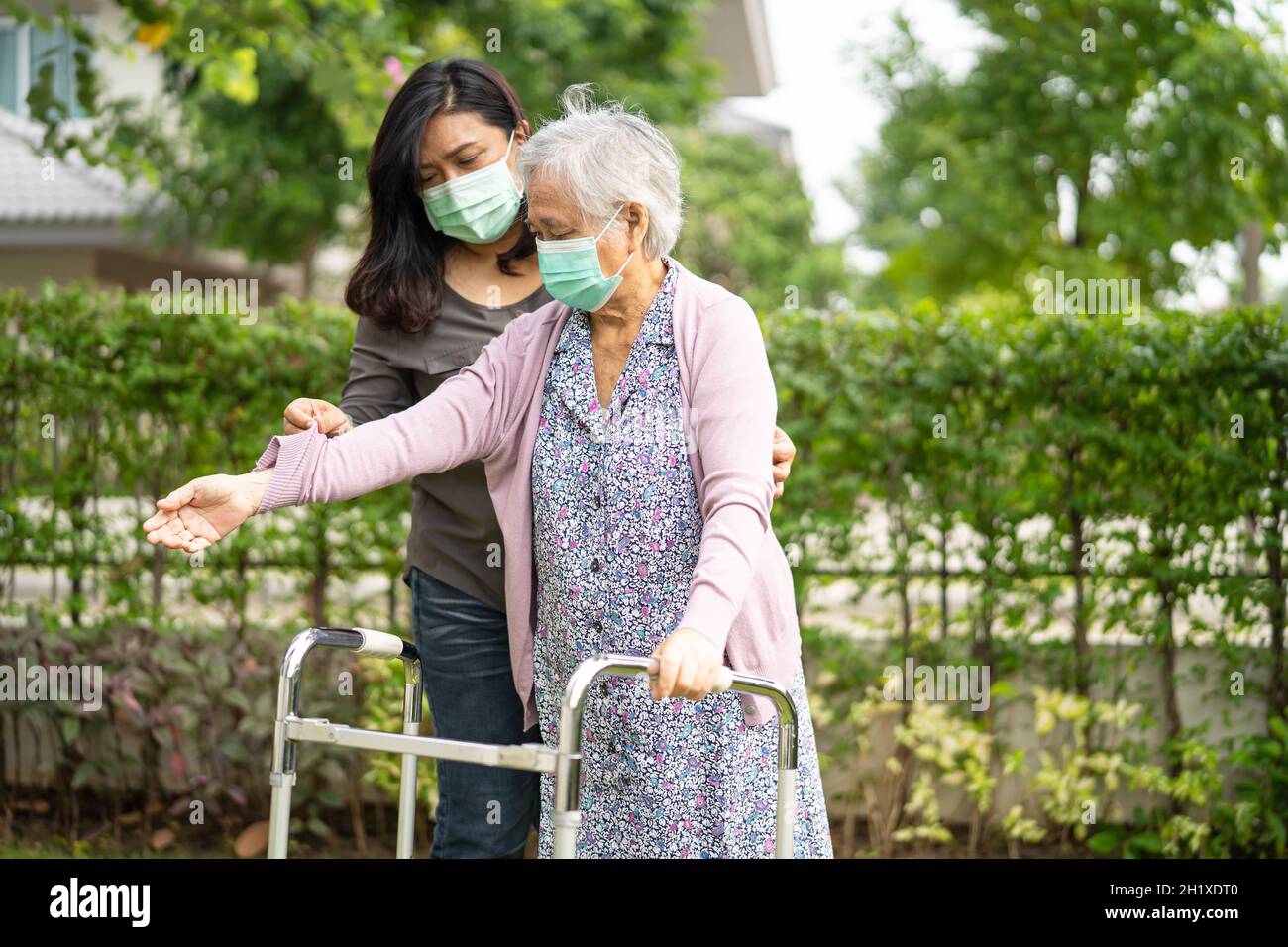 Asian senior or elderly old lady woman wearing a face mask new normal ...