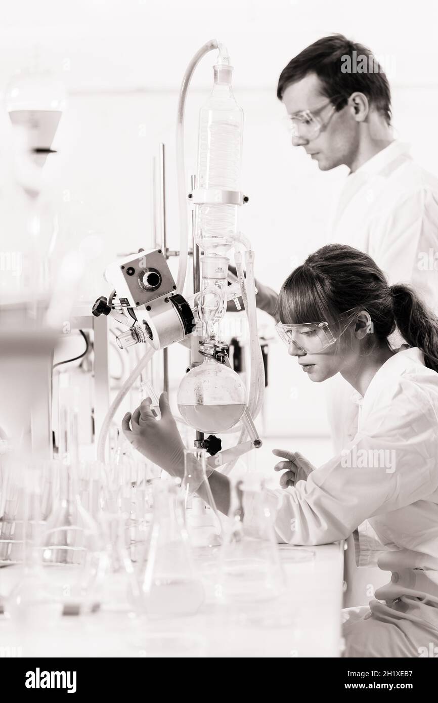 Chemical laboratory research. Attractive young PhD researcher student ...