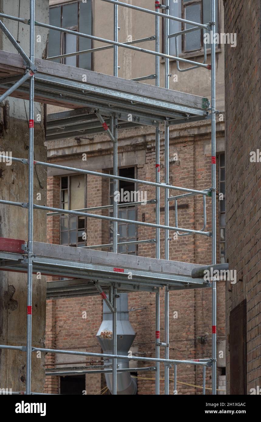 Scaffolding for a factory building to be renovated Stock Photo - Alamy