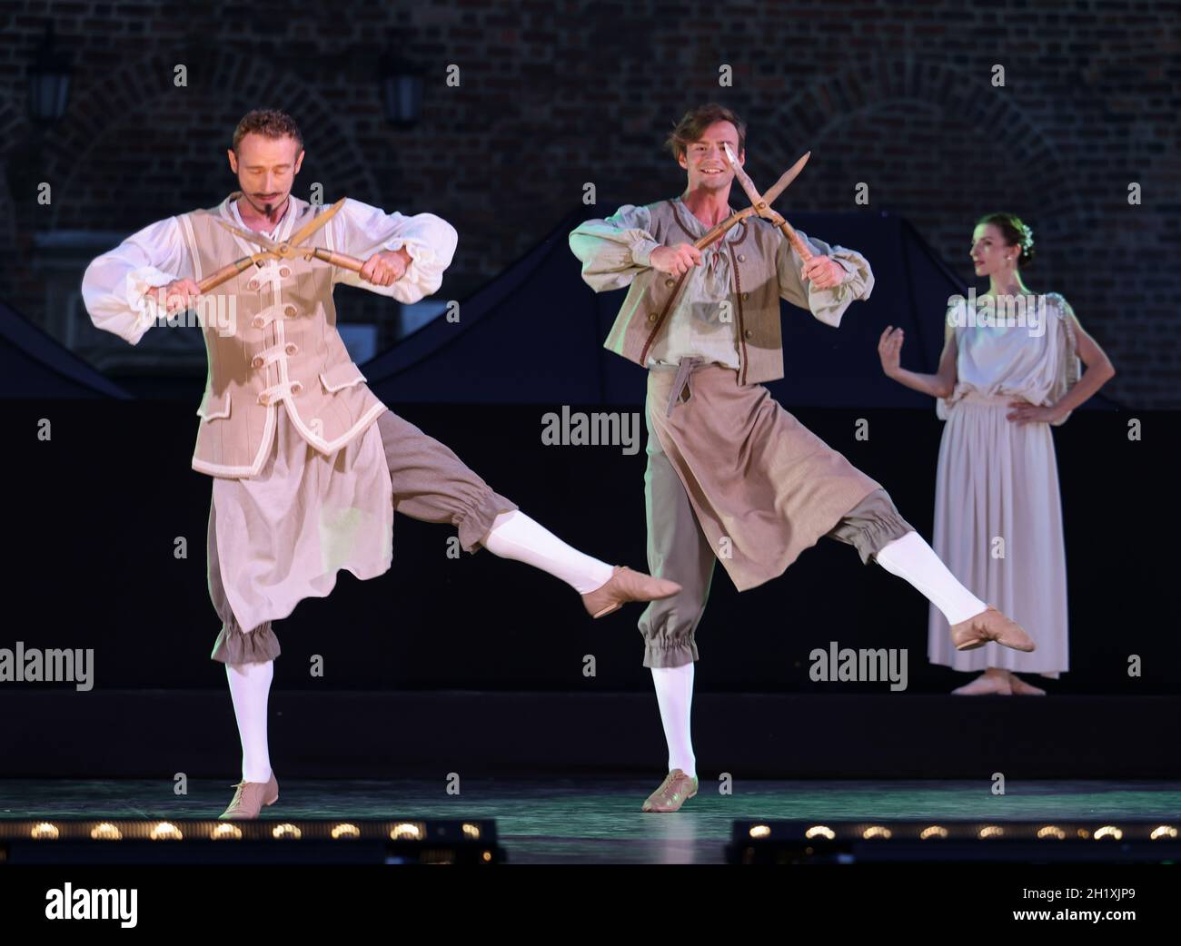 Krakow, Poland - July 25, 2021: Artists in costumes performing on stage ...
