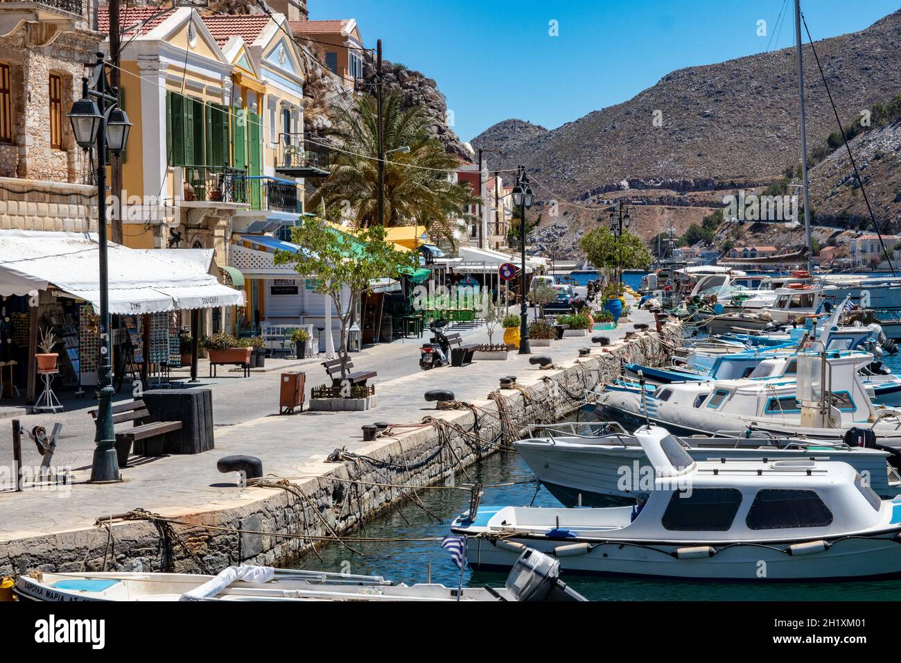 SYMI, Greece - JUN 03, 2021. The harbour of Symi town with the ...