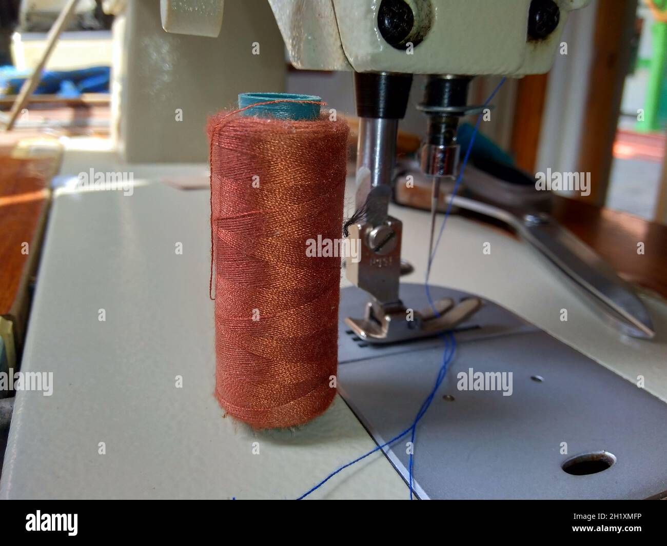 Thread for sewing with a natural background Stock Photo - Alamy