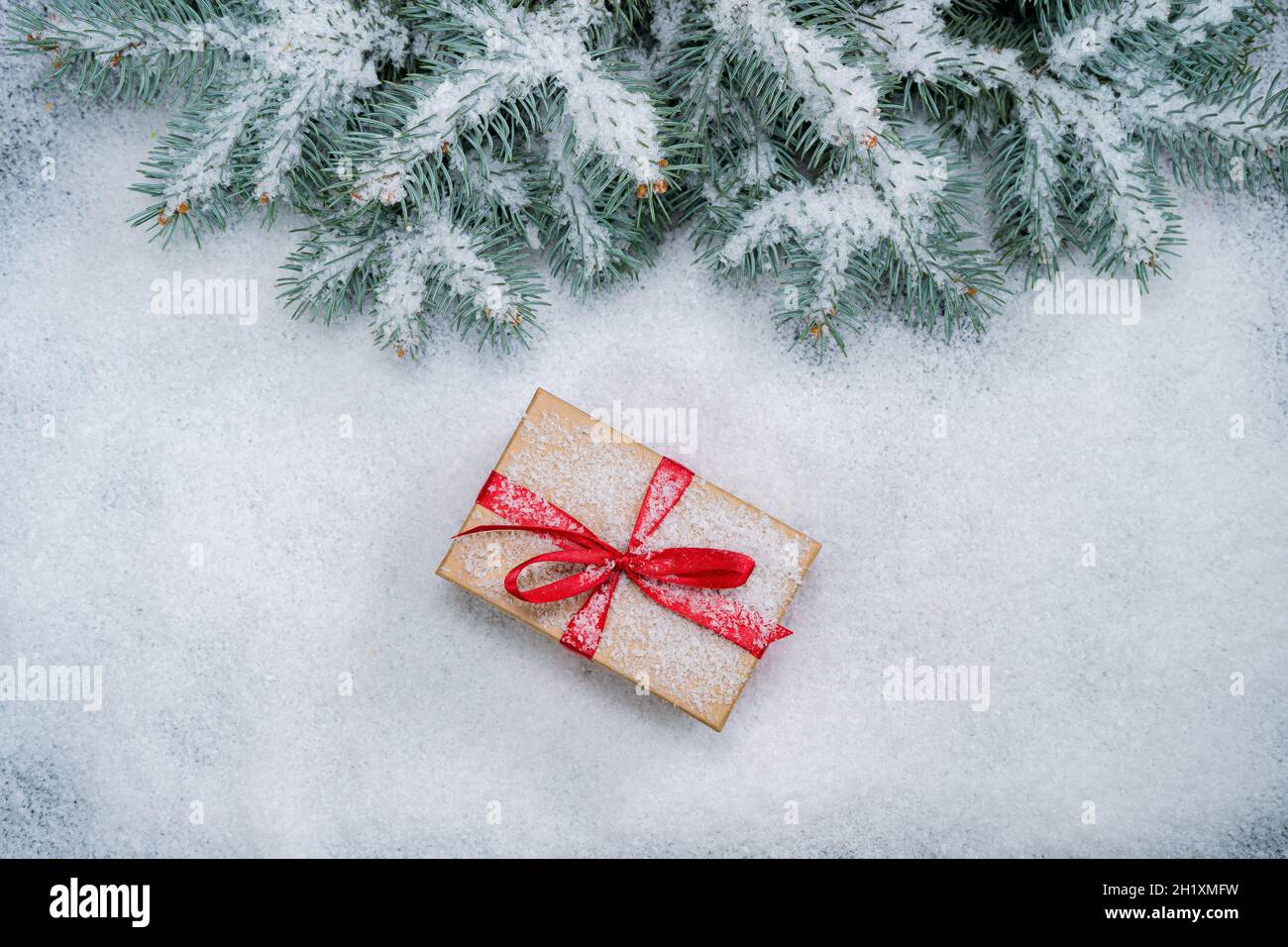 Christmas background with gift boxes in snow Stock Photo - Alamy