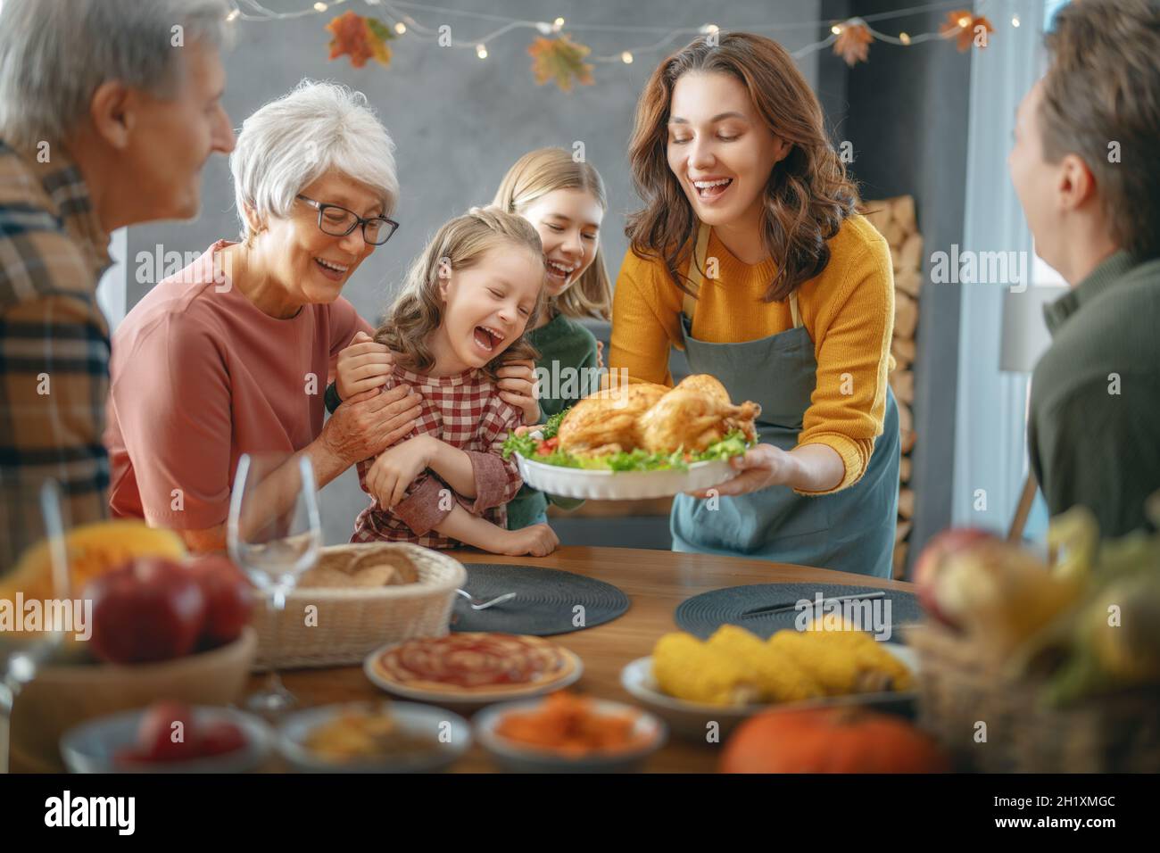 Thanksgiving Day, Autumn feast. Happy family sitting at the table and ...
