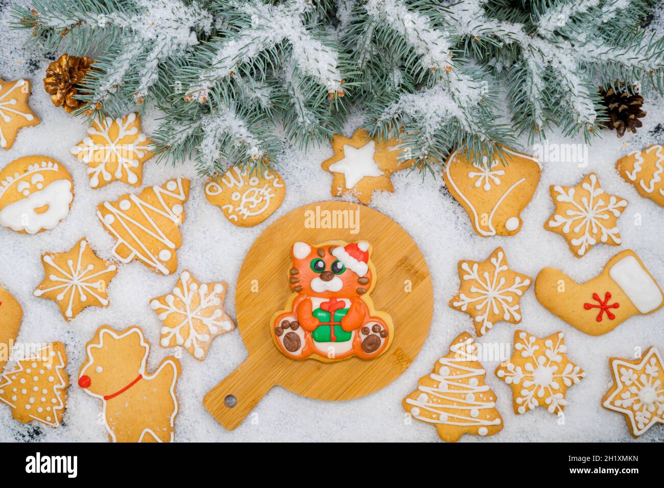 Pattern of gingerbread cookies in different shapes on a snow surface ...