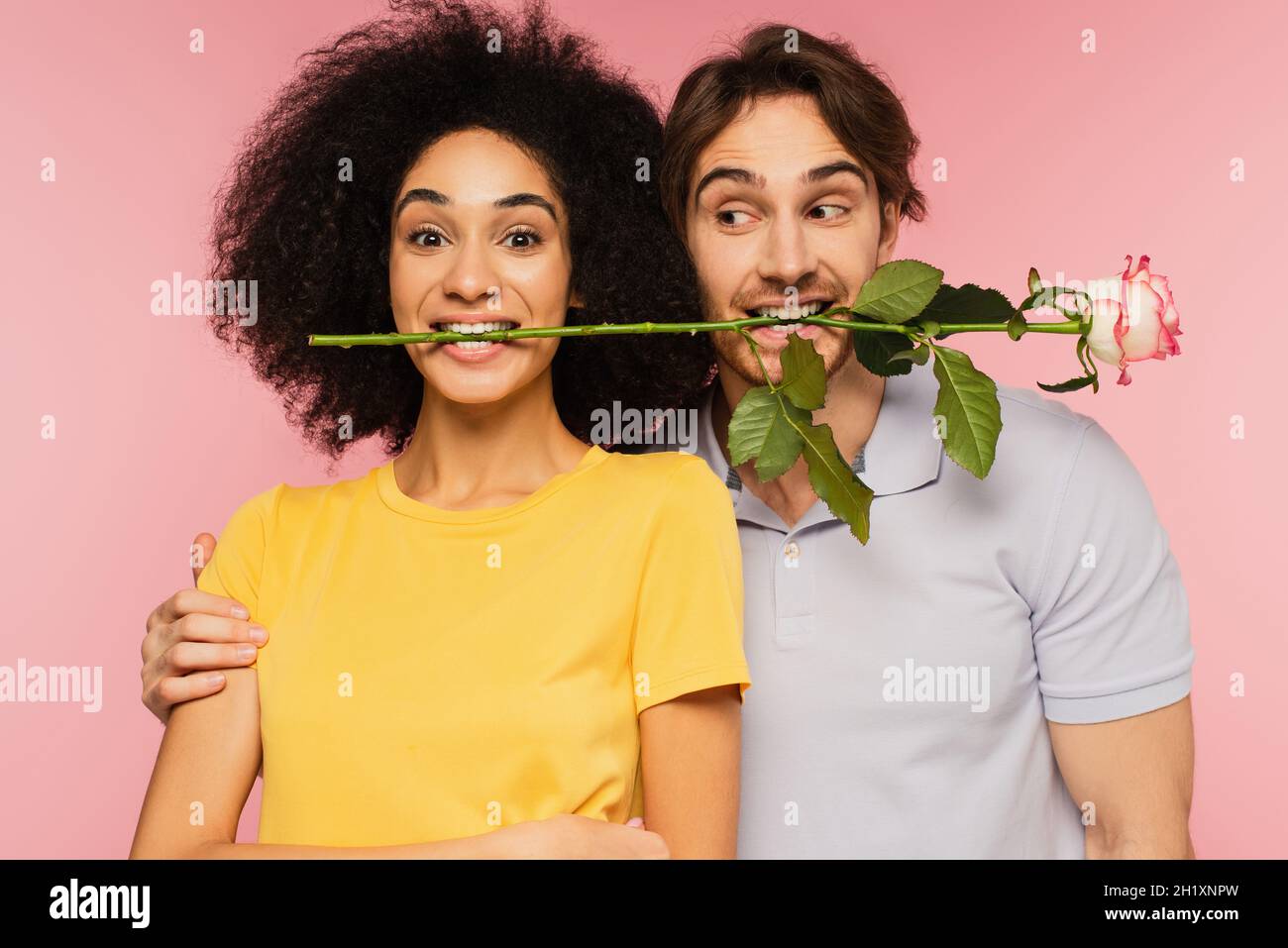 Woman holding flower with her teeth hi-res stock photography and images ...