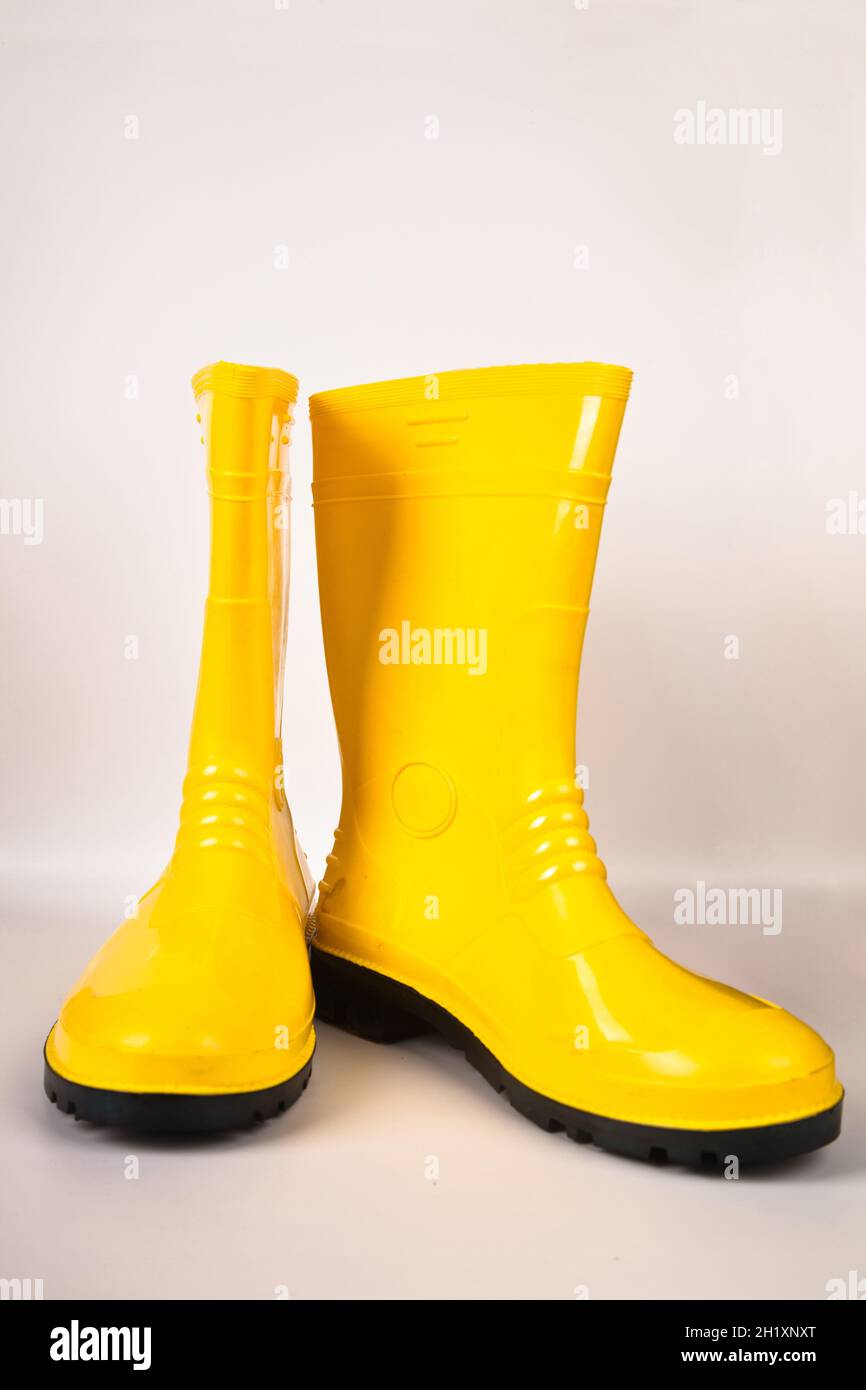 Robust and waterproof yellow rubber boots isolated on white background ...