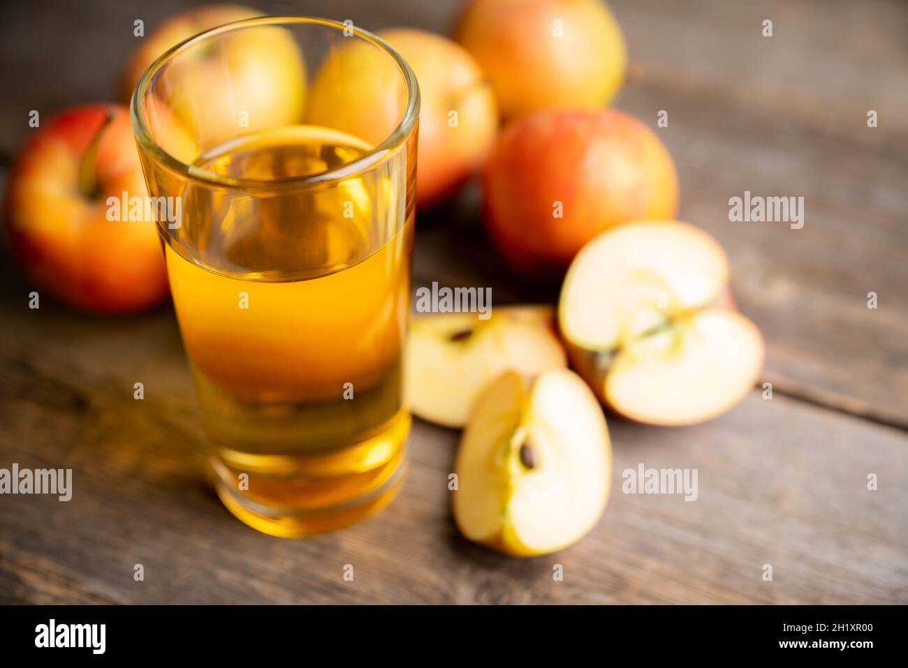 Apple juice with freshly harvested apples on the rustic background ...