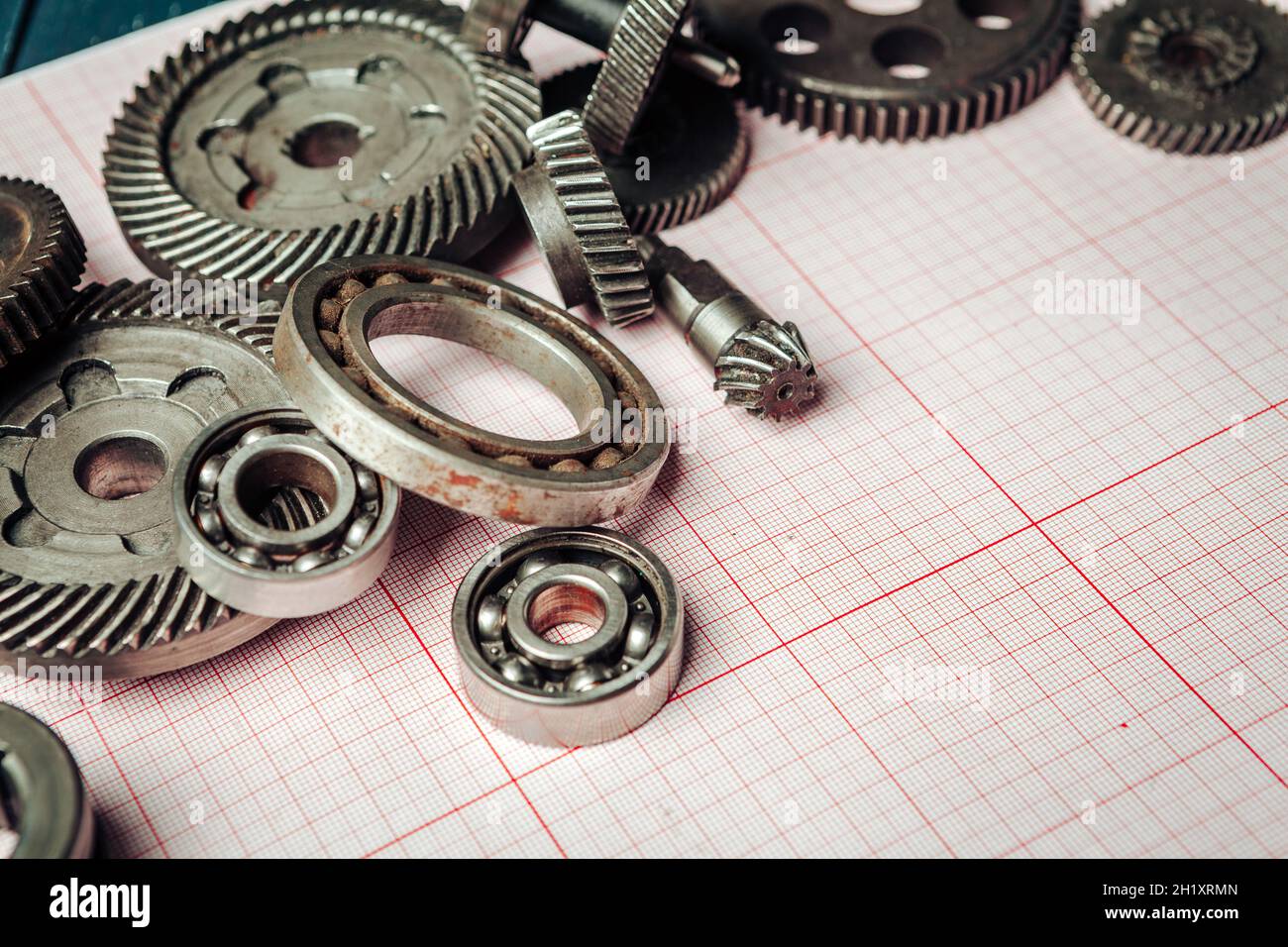 Car parts on graph paper close up. Engineering concept Stock Photo - Alamy