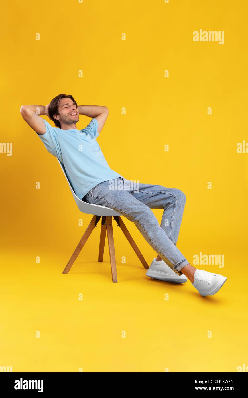 Man leaning on chair hi-res stock photography and images - Alamy