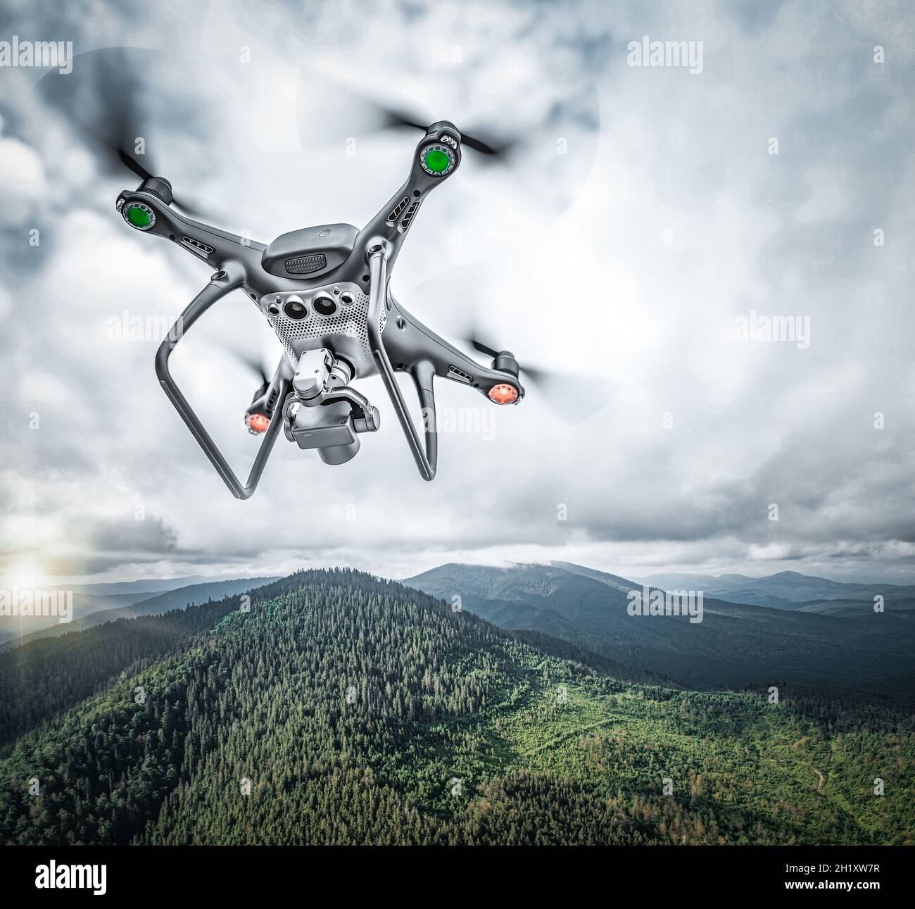Dark drone flying above mountains Stock Photo - Alamy