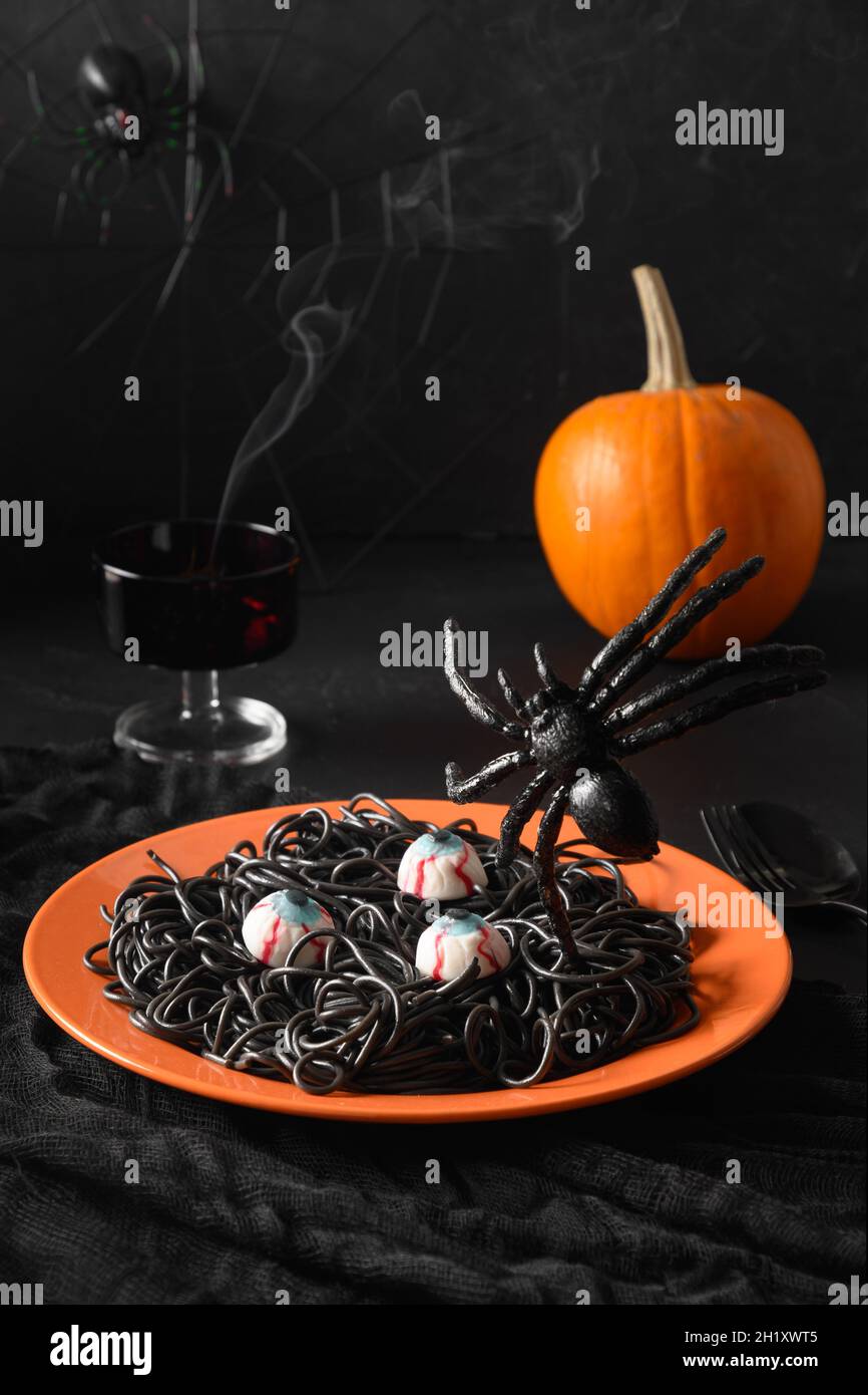 Halloween funny Italian black pasta squid ink decorated spiders in ...