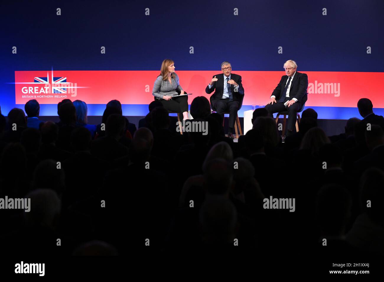 Prime Minister Boris Johnson (right) appears on stage in conversation ...