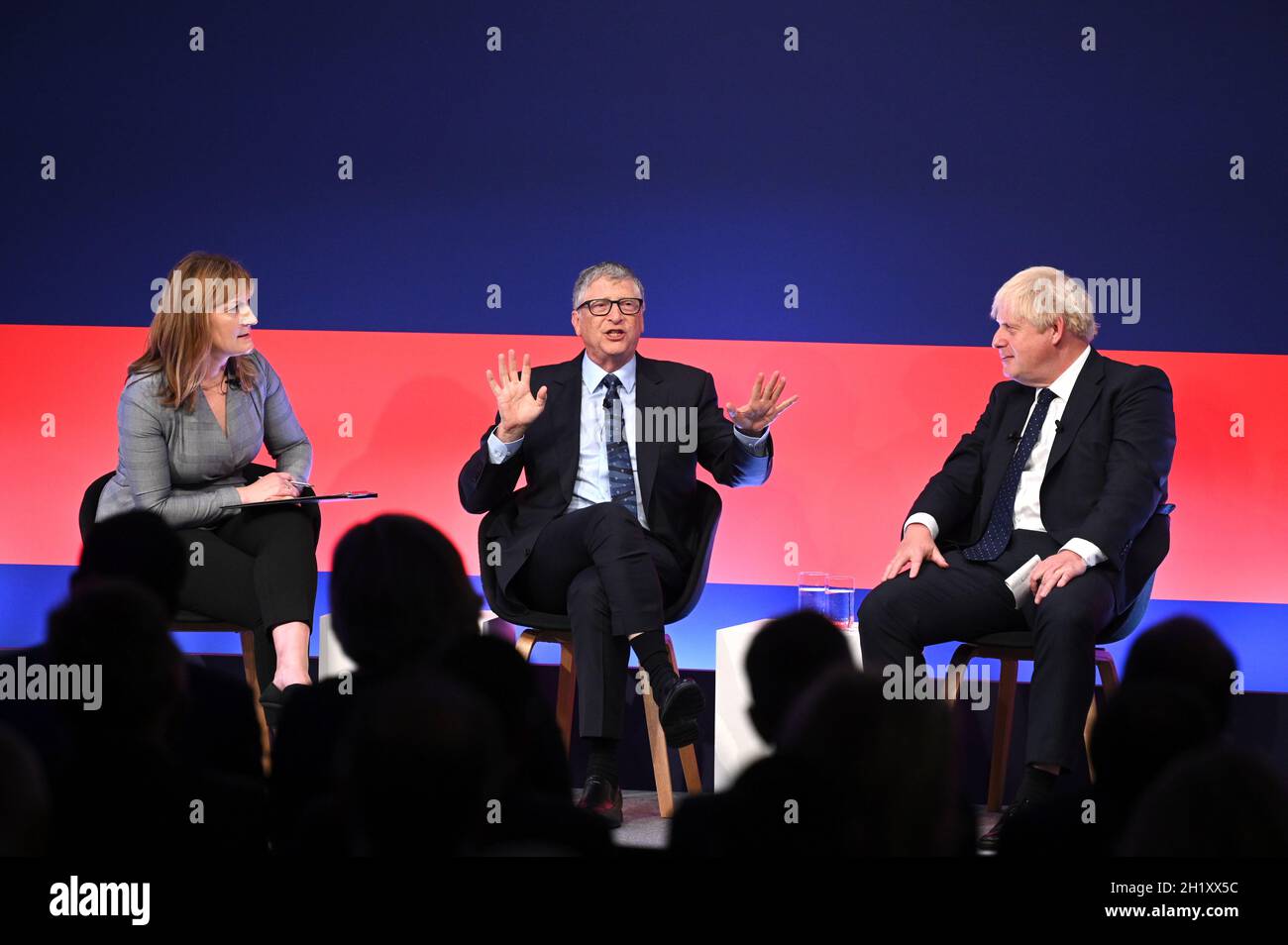 Prime Minister Boris Johnson (right) appears on stage in conversation ...
