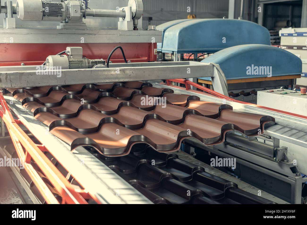 Production line of metal tile for roof. Conveyor belt at metalworking ...