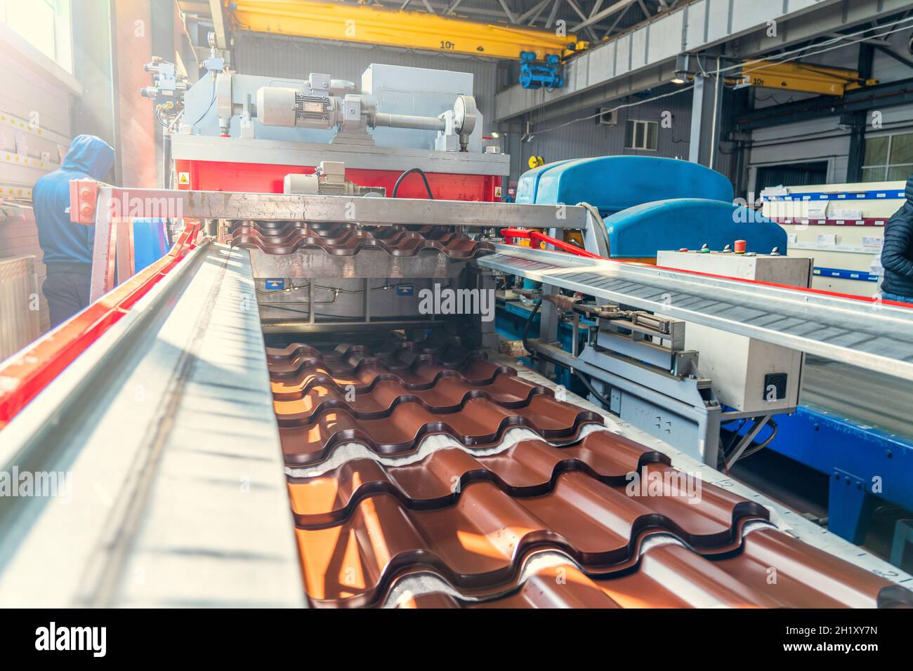 Production line of metal tile for roof. Conveyor belt at metalworking ...