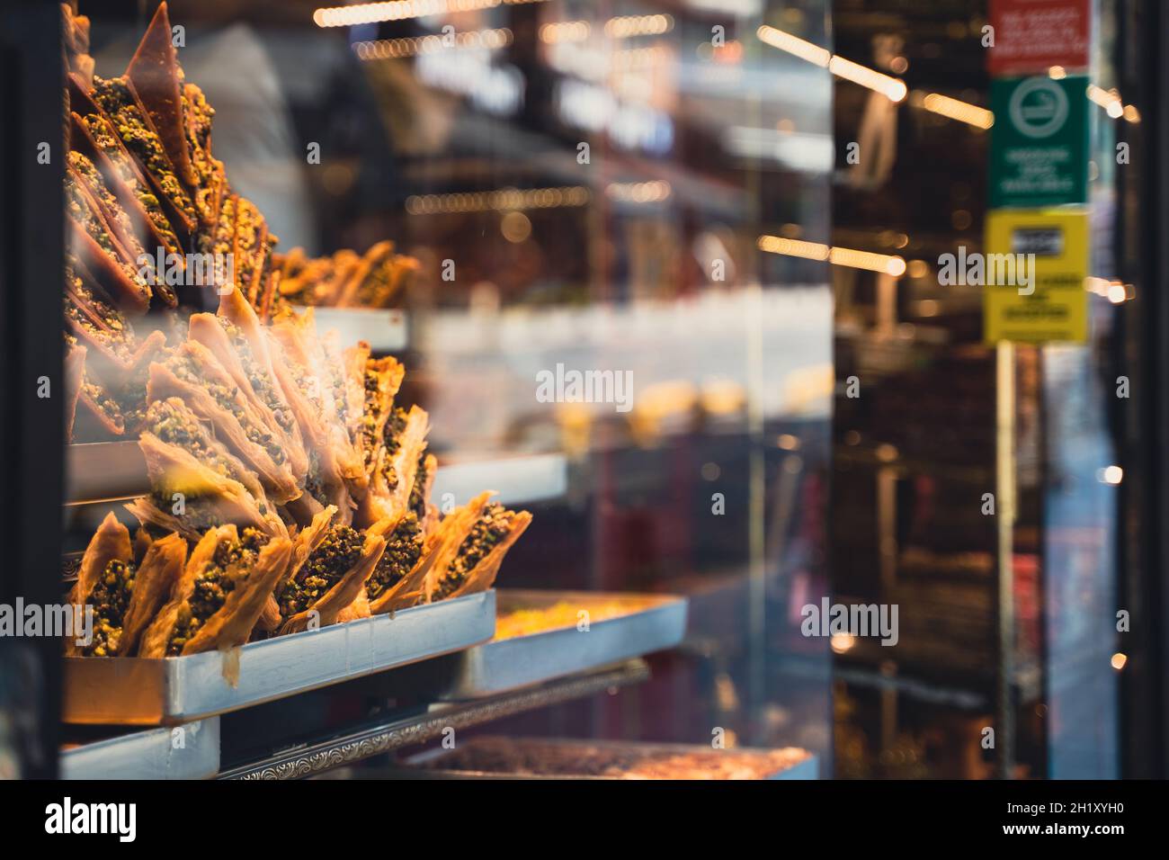 rows of Turkish traditional baklava sweets desserts lined up in street ...