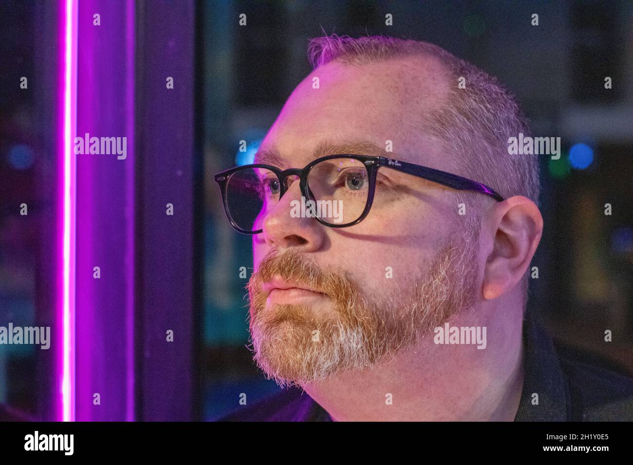 Neon lit face Stock Photo - Alamy