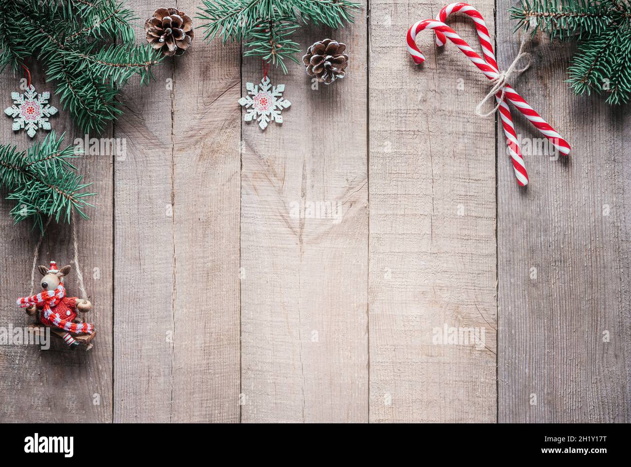 Christmas background with fir tree branches, Christmas lights, and mini ...