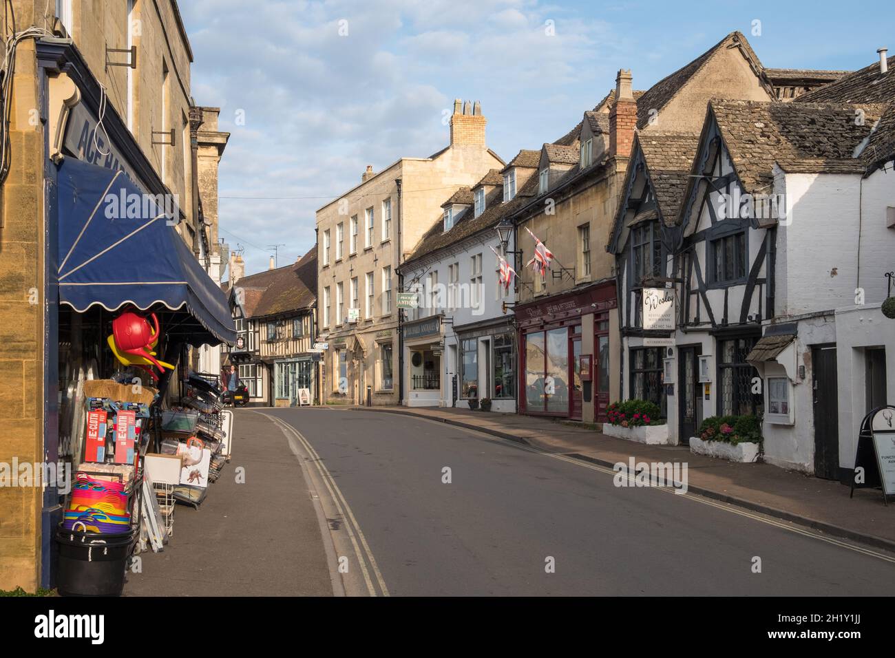 Shops lining Winchcombe High Street in the Cotswolds, Gloucestershire ...