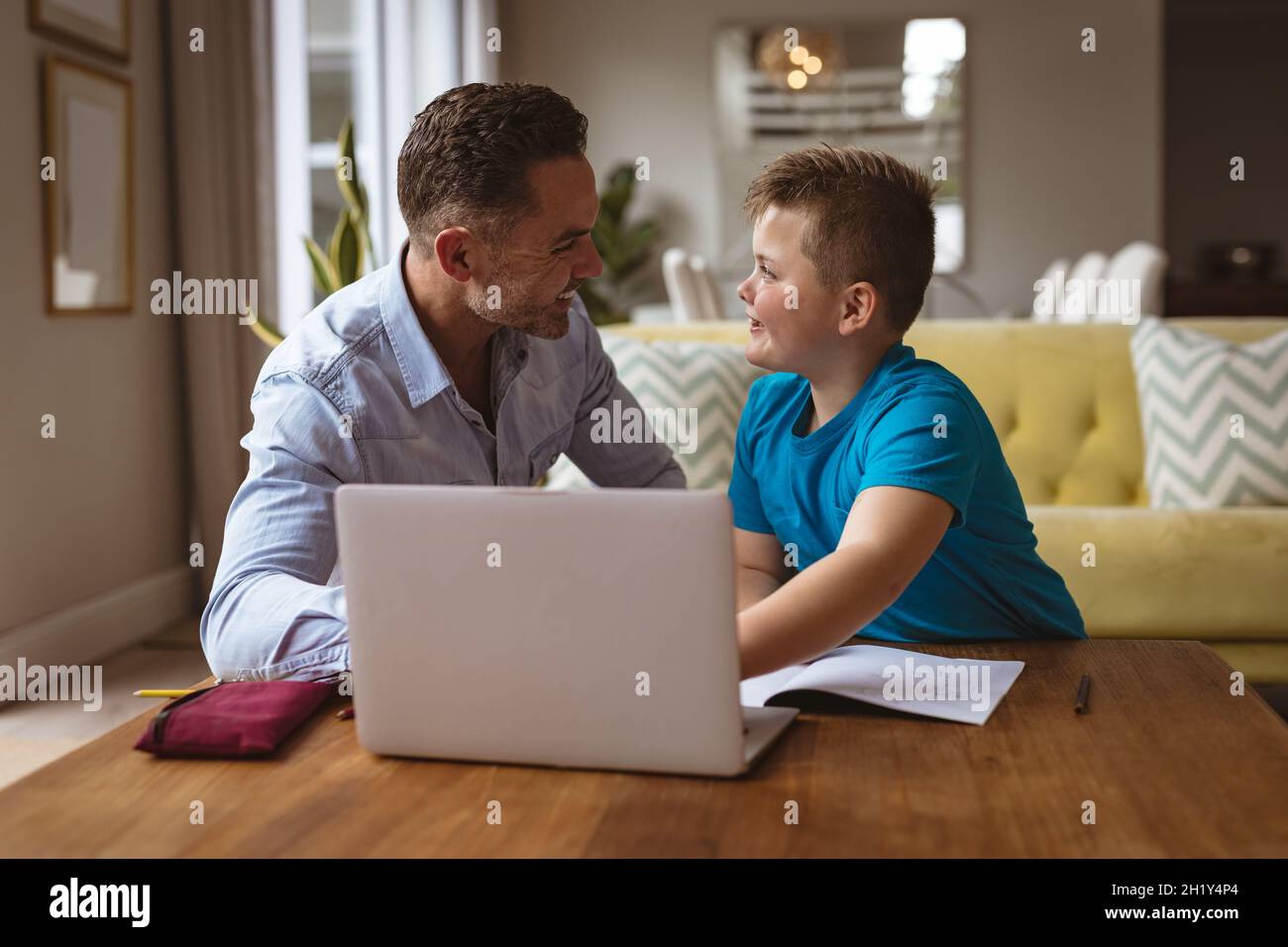 Father son laptop learning hi-res stock photography and images - Alamy