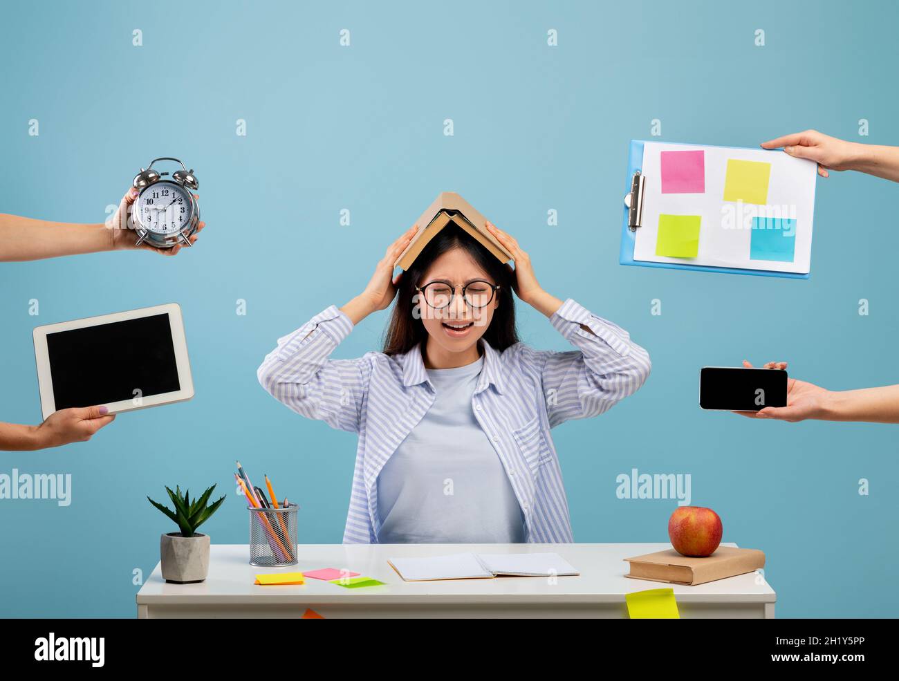 Sad asian lady stressed by a lot of work, sitting at the desk with ...