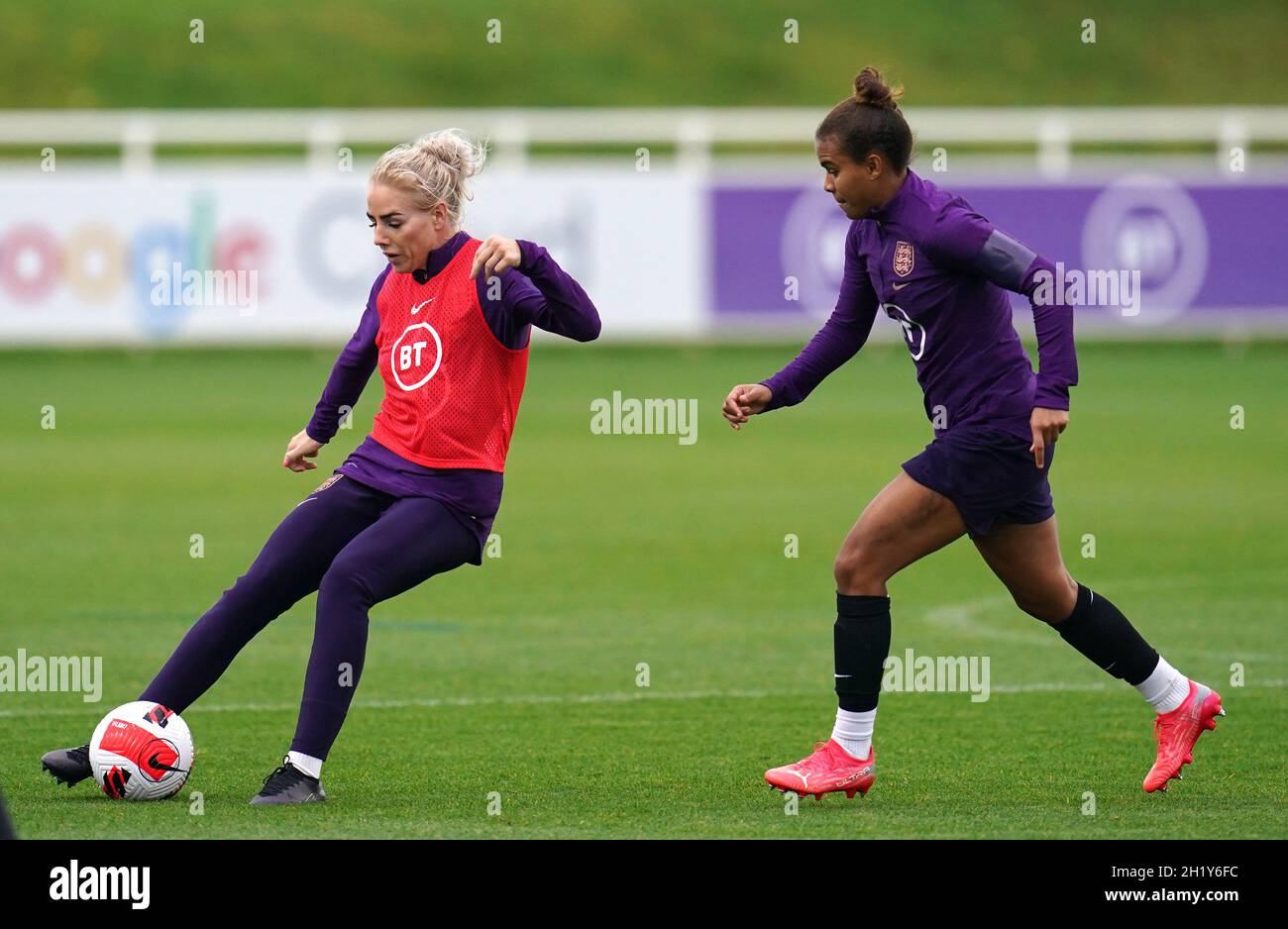 England's Alex Greenwood and Nikita Parris (right) during a training ...
