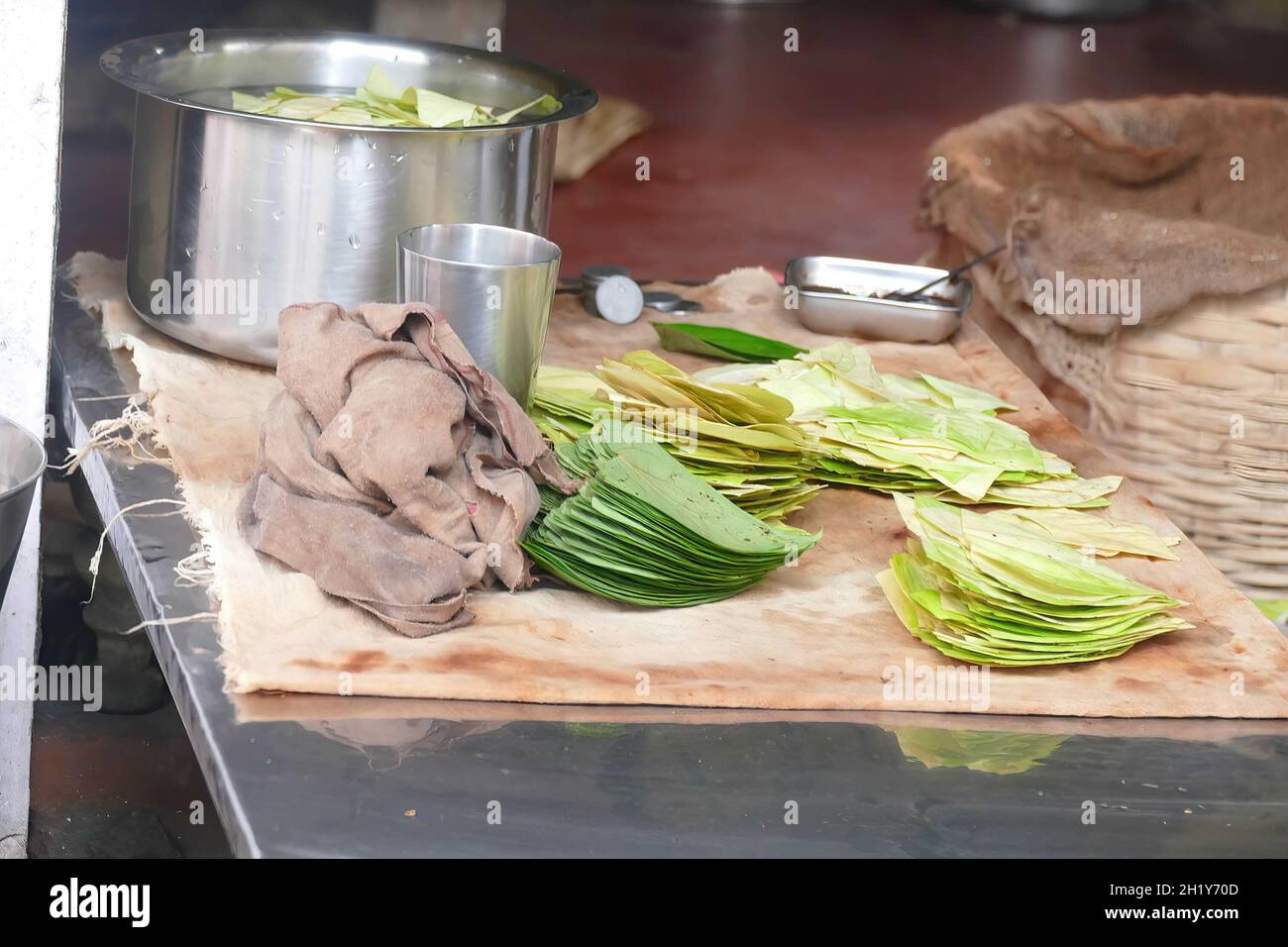 Closeup shot of leaves for pan and other condiments, on the table in ...