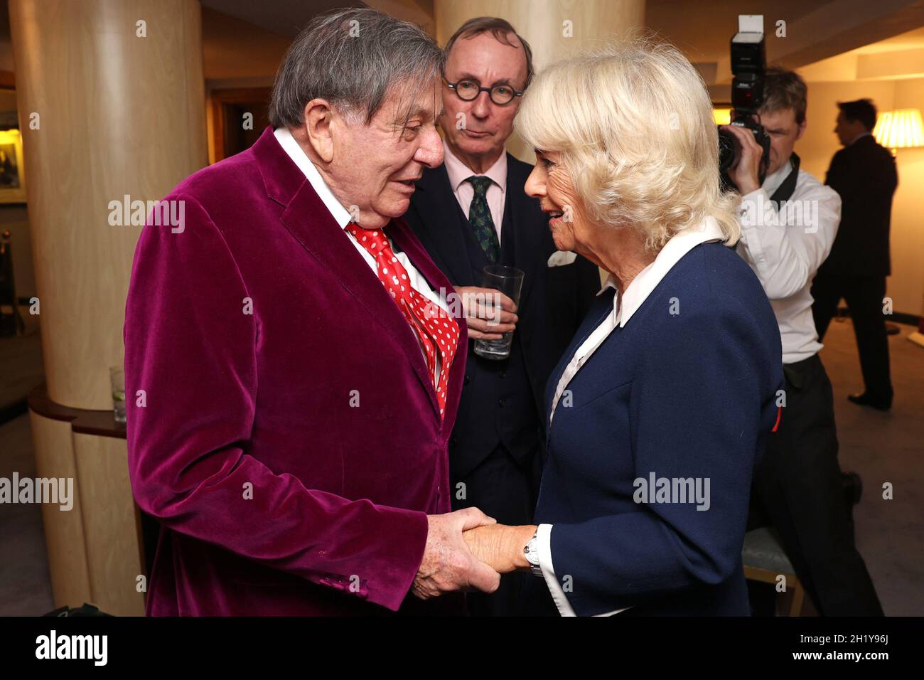 The Duchess of Cornwall speaks with Barry Humphries (left) and A. N ...