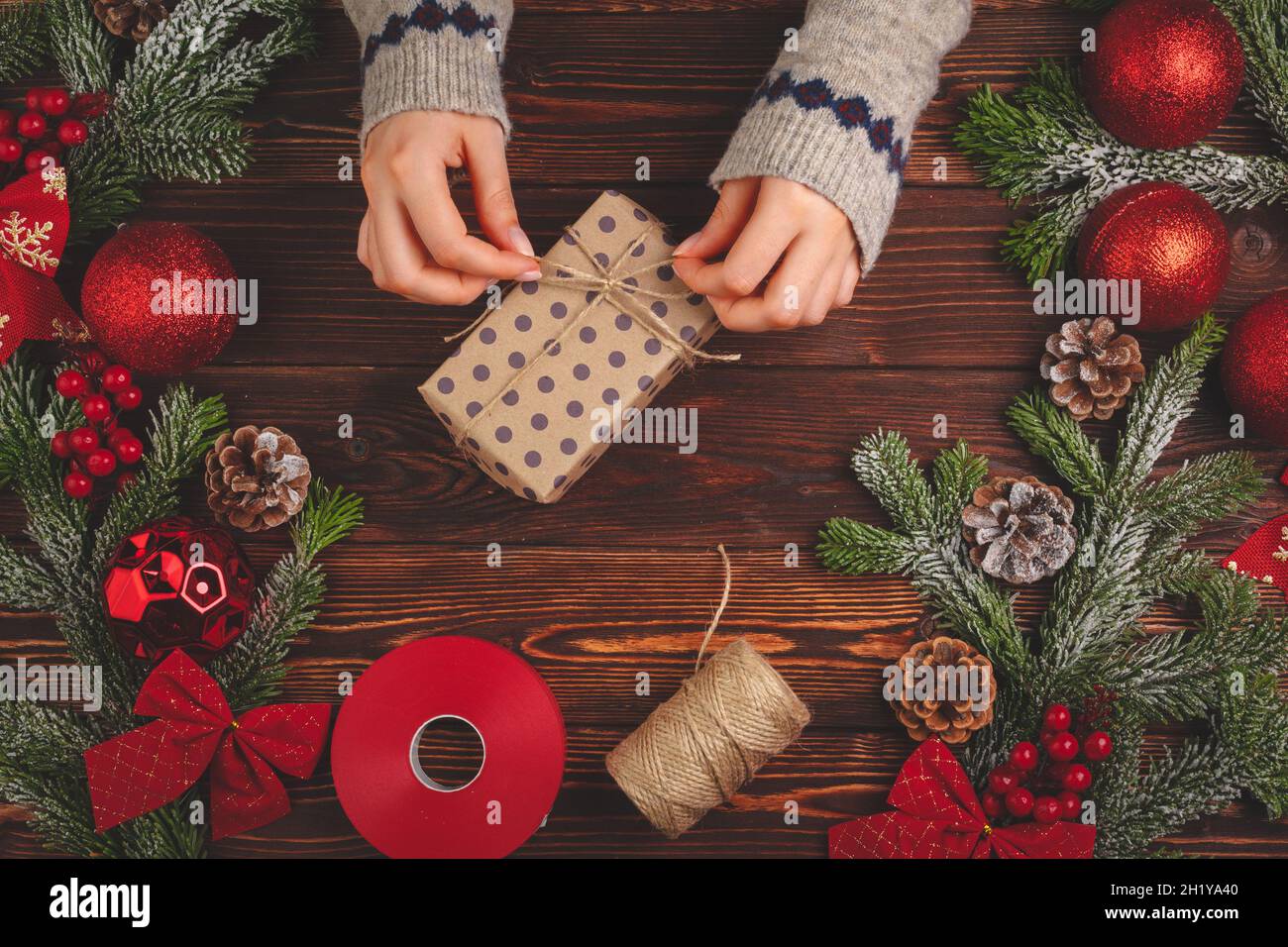 Christmas time. Process of packing gifts for holidays Stock Photo - Alamy