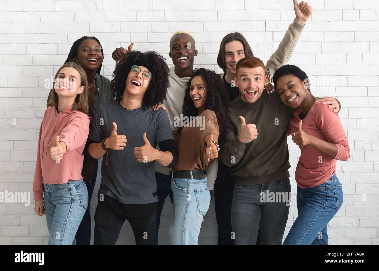 Happy millennials different nationalities showing thumb ups Stock Photo ...