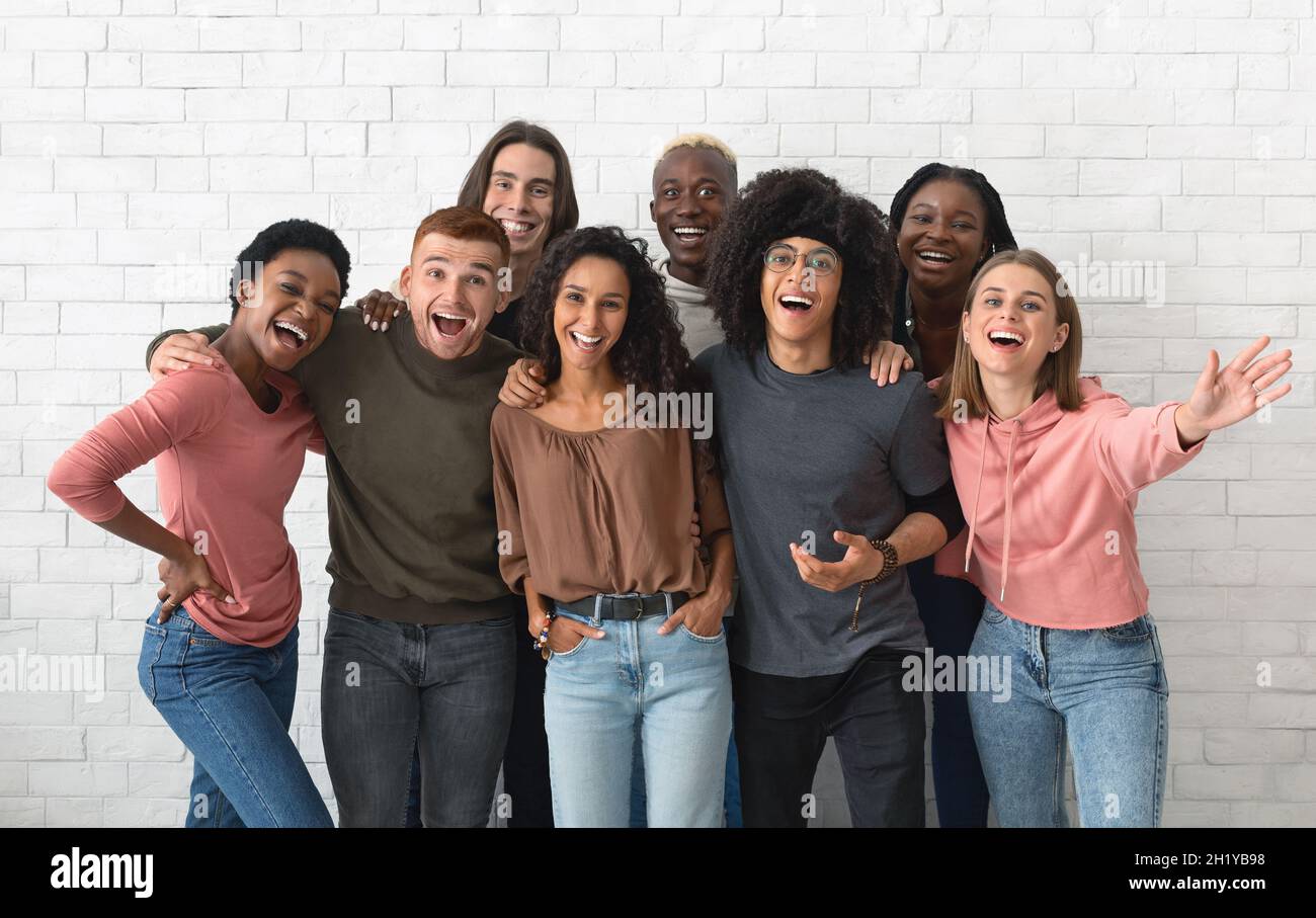 Cheerful multiracial men and woman students showing their white smiles ...