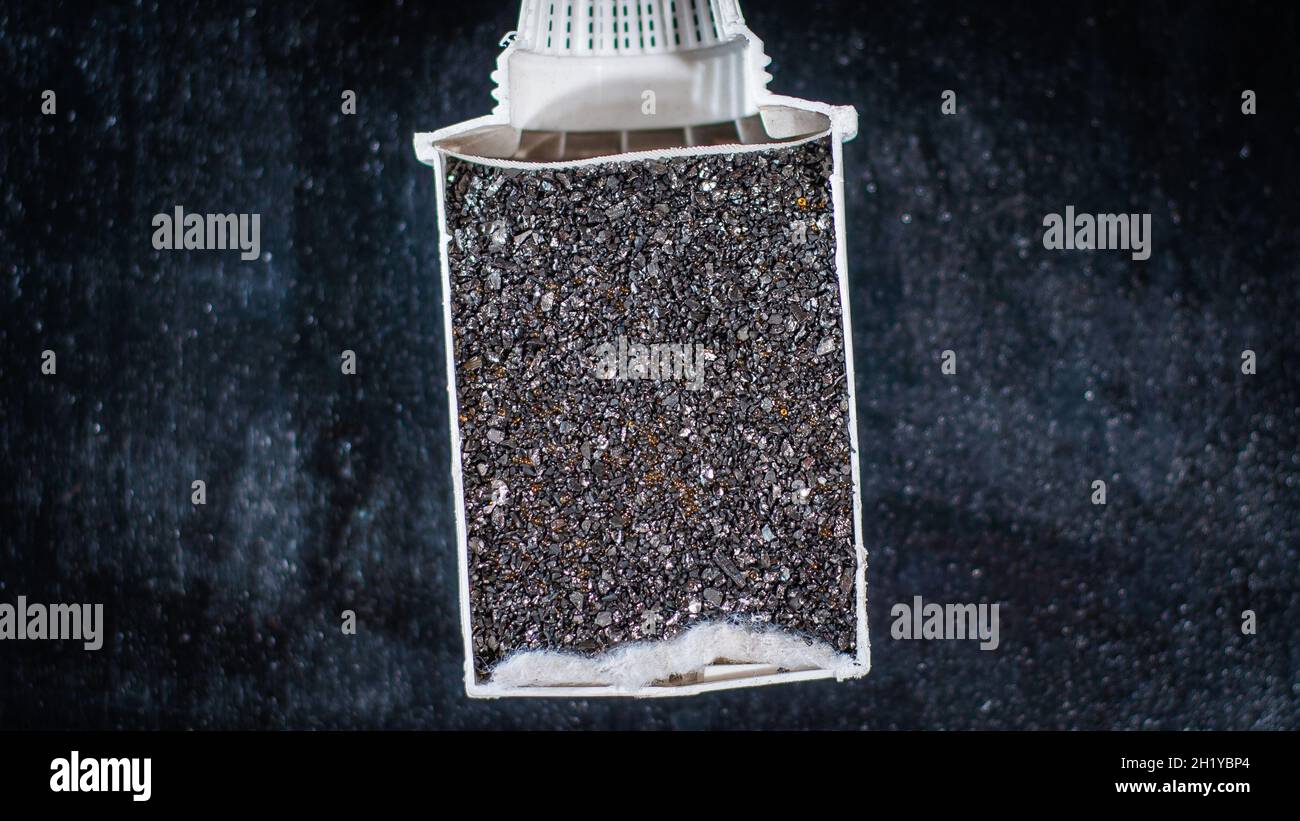 Internal filling of activated carbon water filter Stock Photo - Alamy