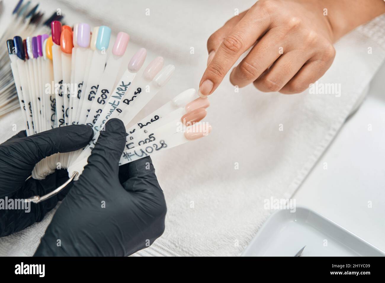 Female client doing manicure in beauty salon Stock Photo - Alamy