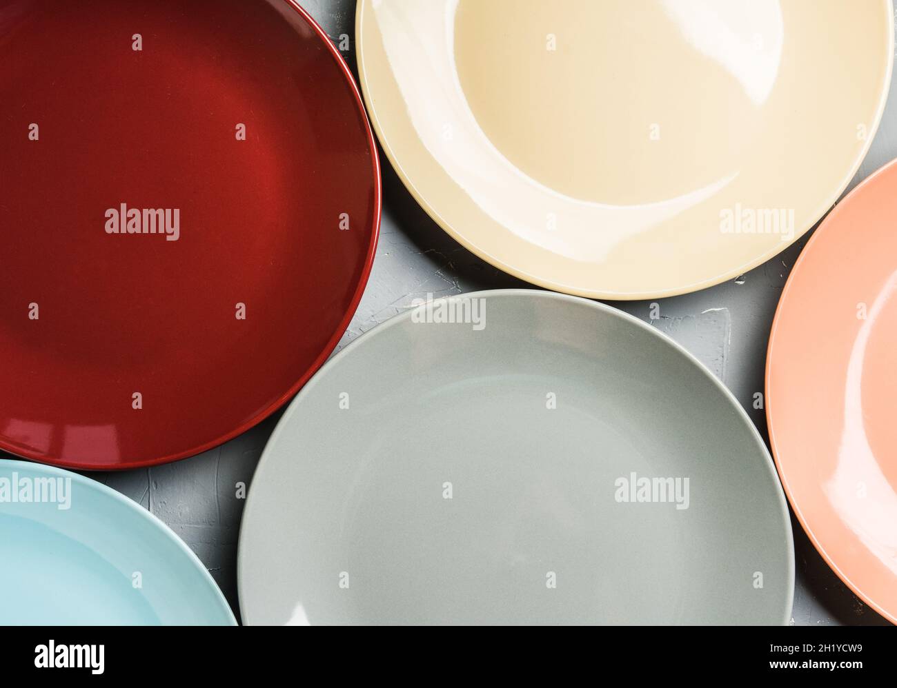 Clean different colour plates on the rustic background. Selective focus ...