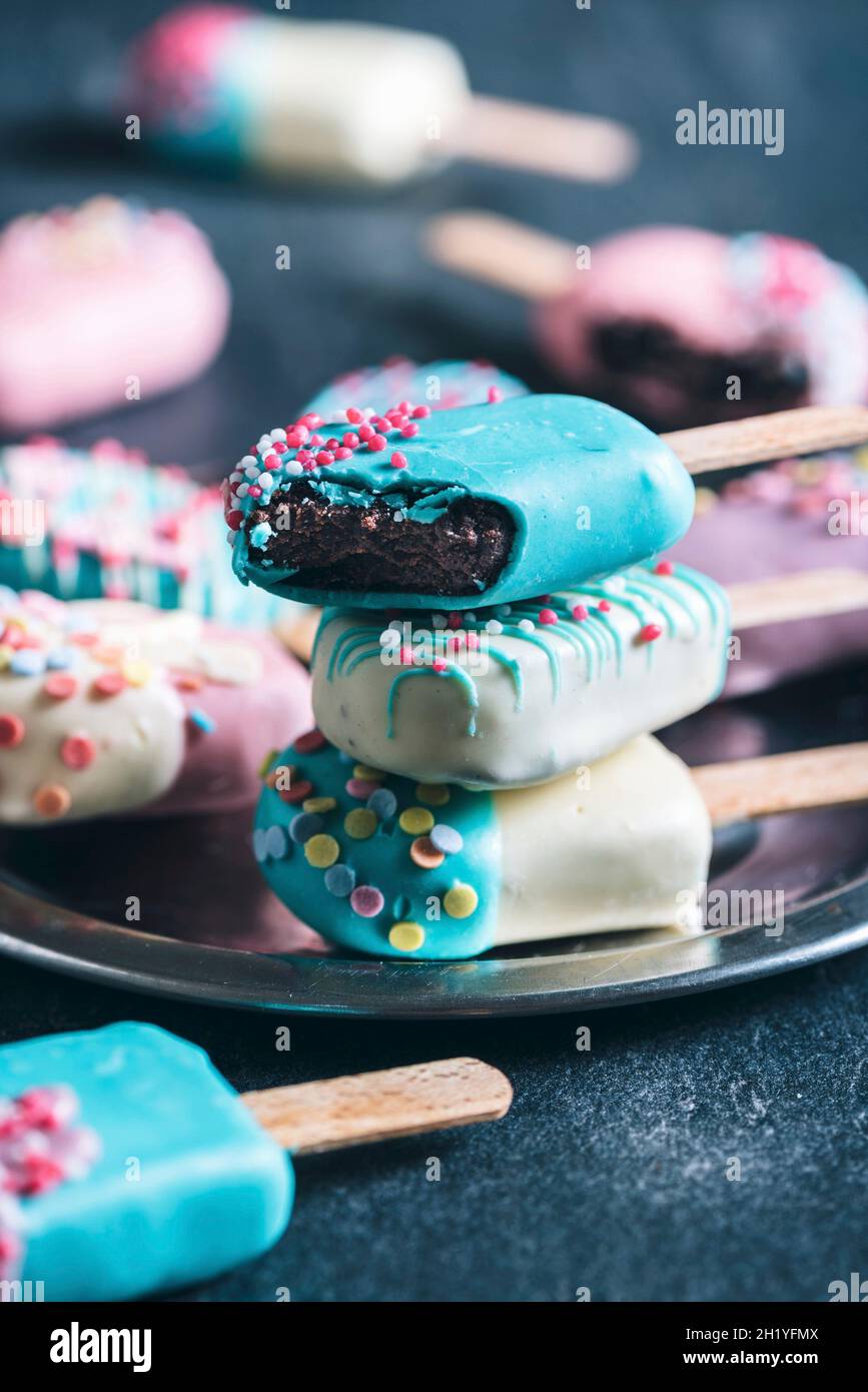 Cake pops in the shape of ice lollies with brightly coloured icing ...
