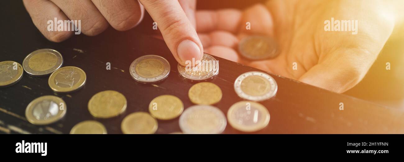 business man counting money. rich male hands holds and count coins of ...