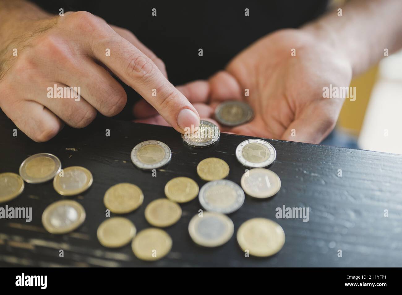 business man counting money. rich male hands holds and count coins of ...