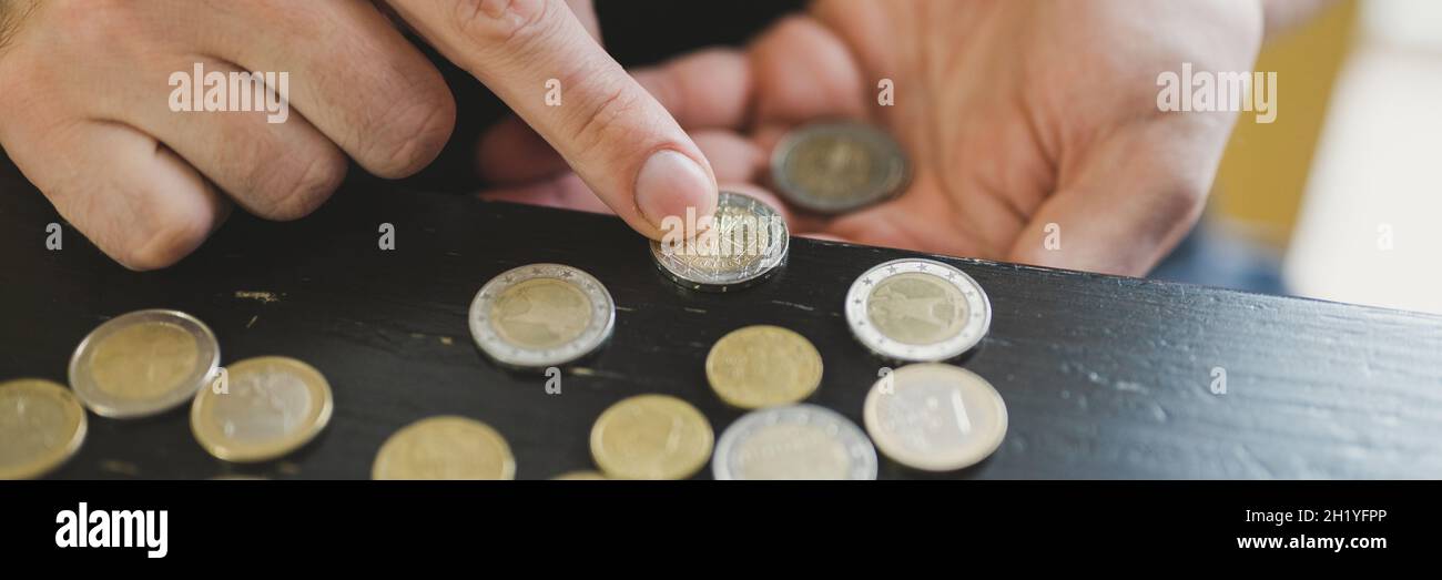 business man counting money. rich male hands holds and count coins of ...