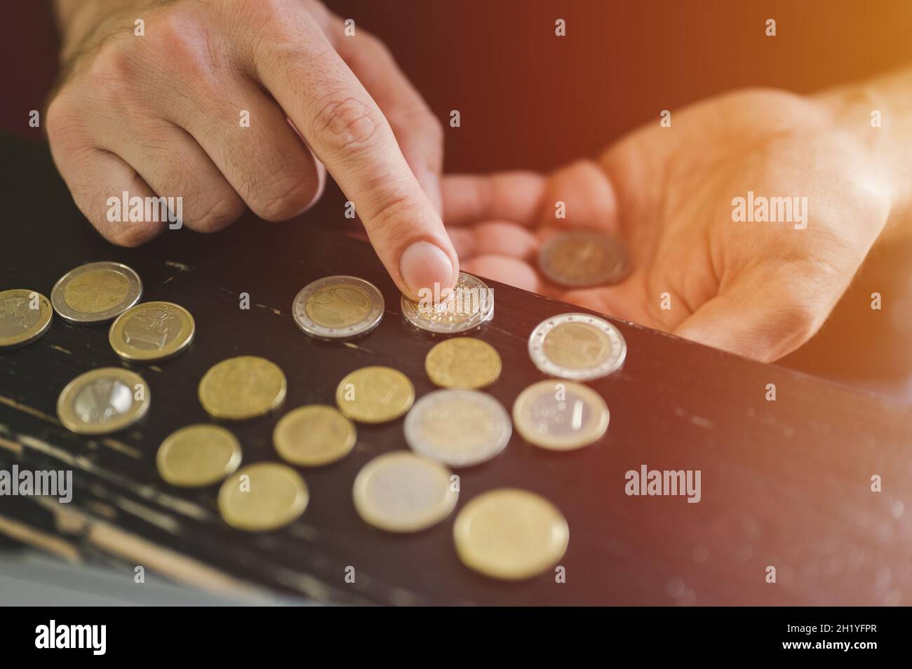 business man counting money. rich male hands holds and count coins of ...