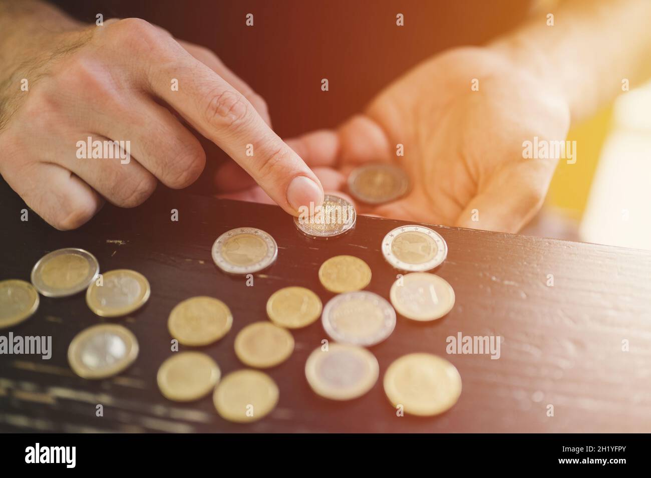 business man counting money. rich male hands holds and count coins of ...